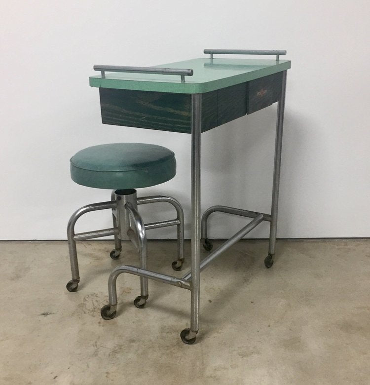 Vintage industrial tubular steel rolling stool and cantilevered table ...